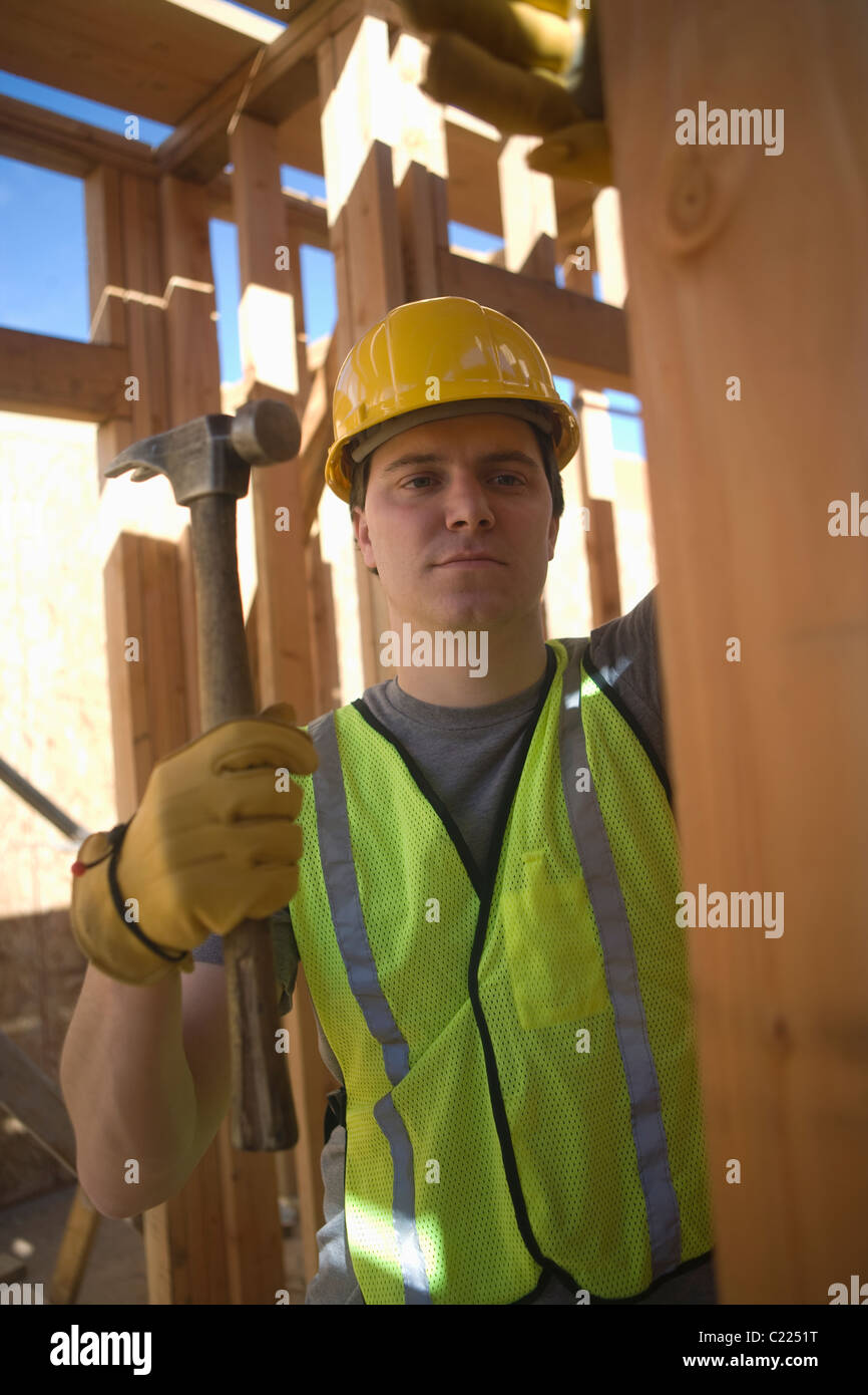 Labourer works on building construction Stock Photo - Alamy