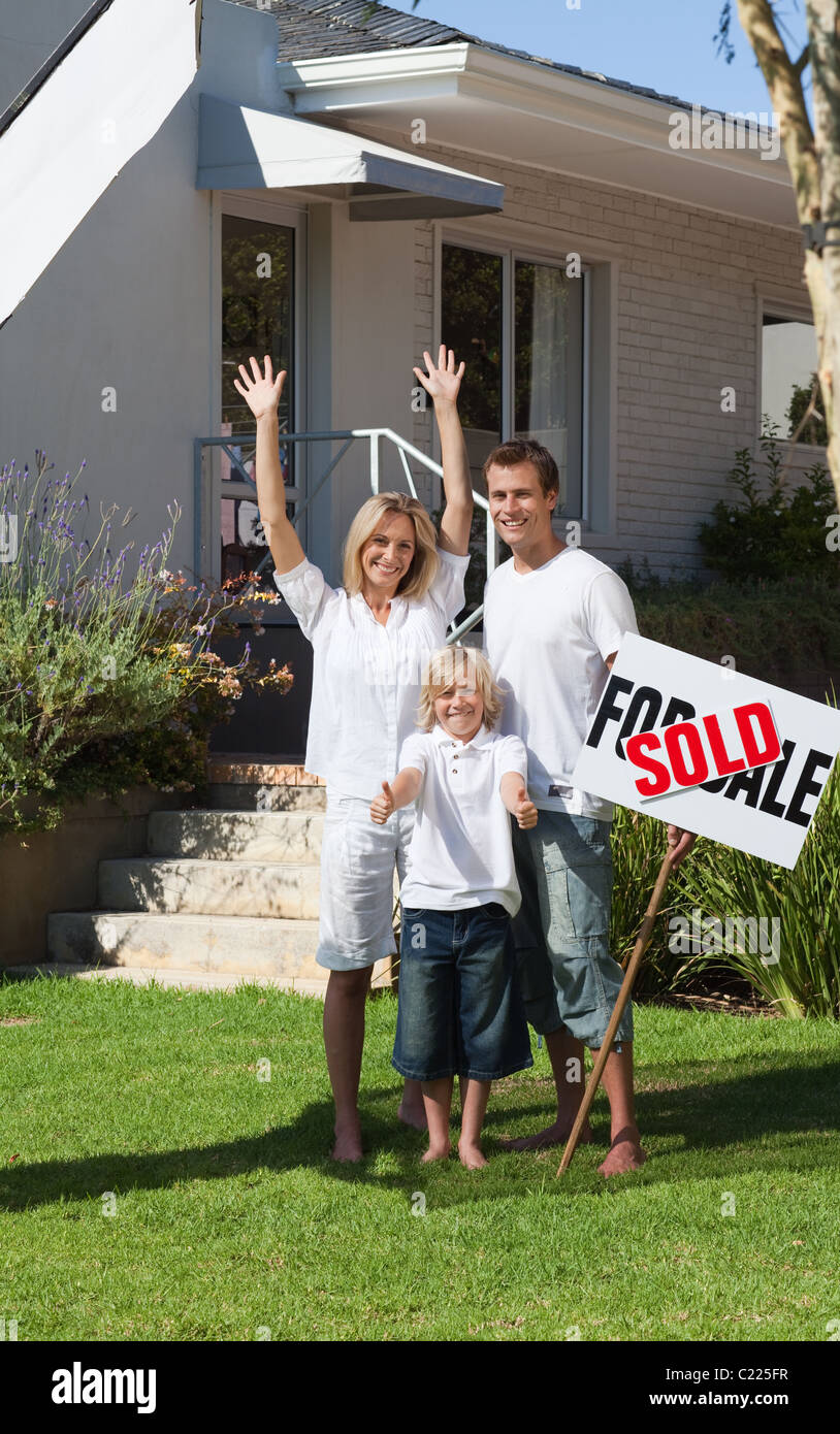 Young family and their new house Stock Photo - Alamy