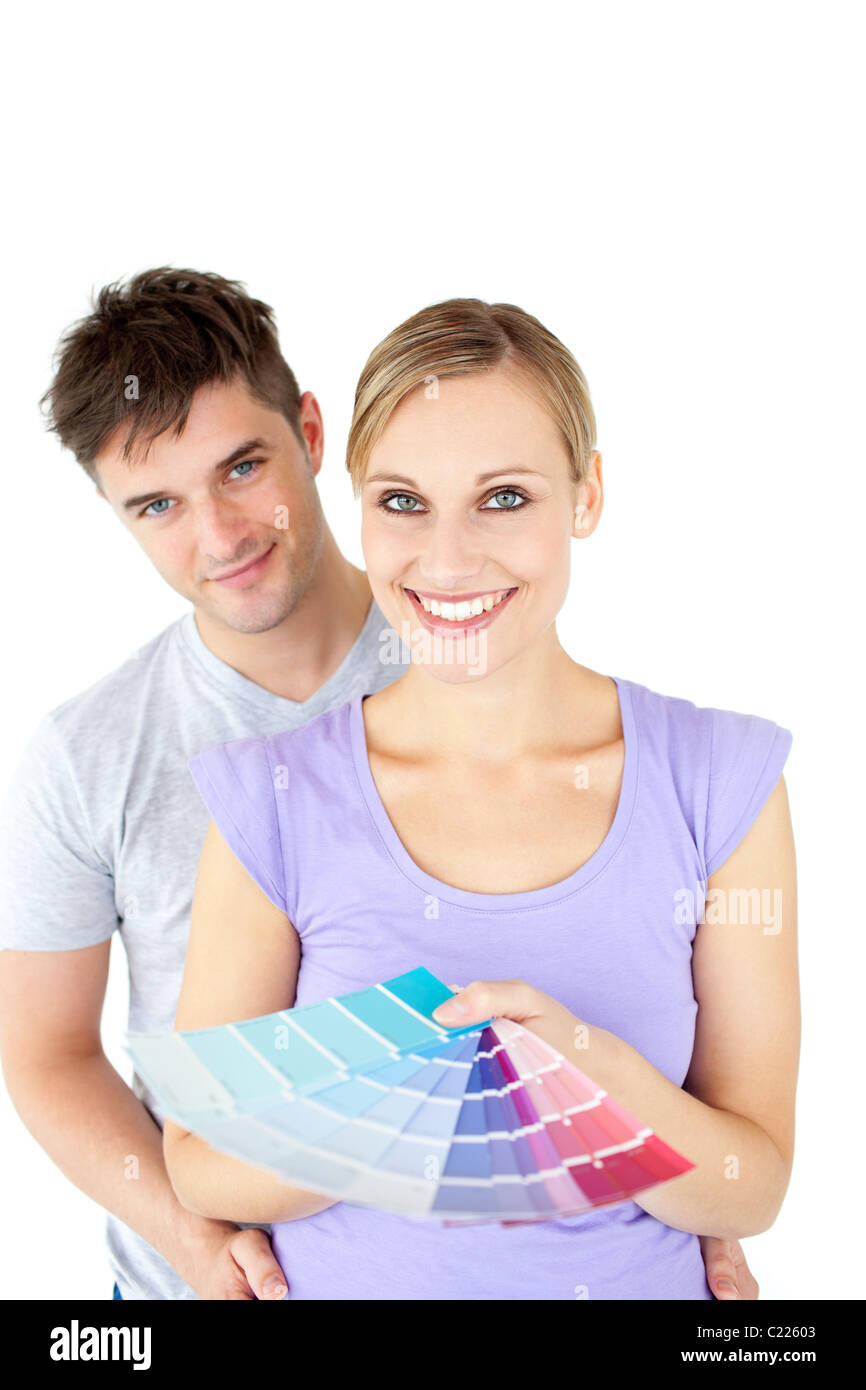 Affectionate young couple choosing colors for painting their room Stock ...