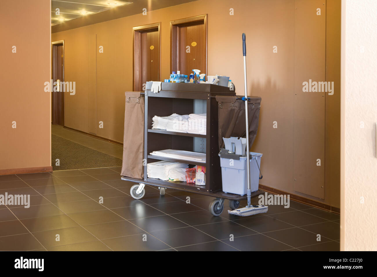 Cleaners trolley in a hotel Stock Photo - Alamy