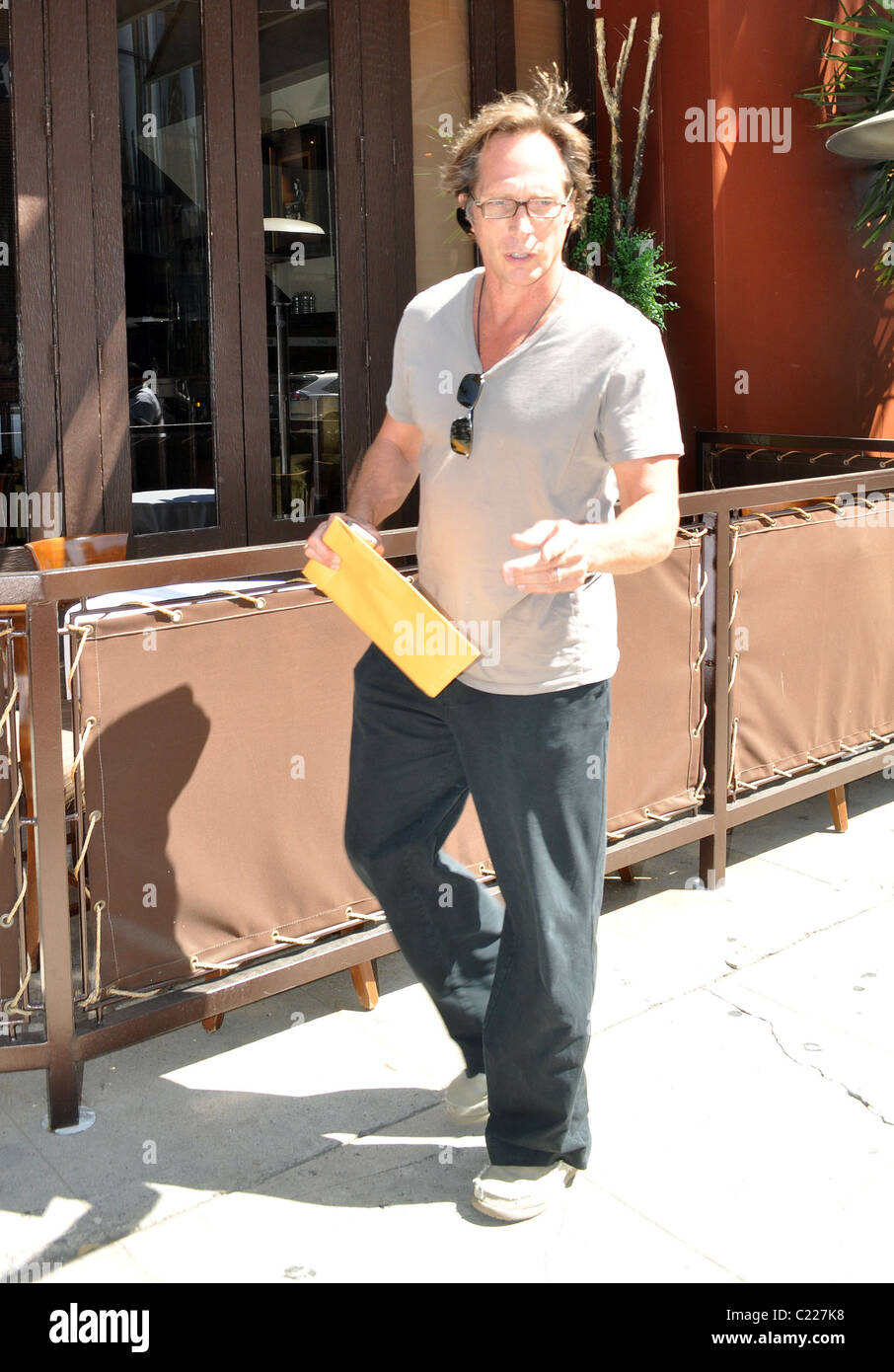 Alex Mahone takes a walk on Bedford Drive Los Angeles, California - 01. ...