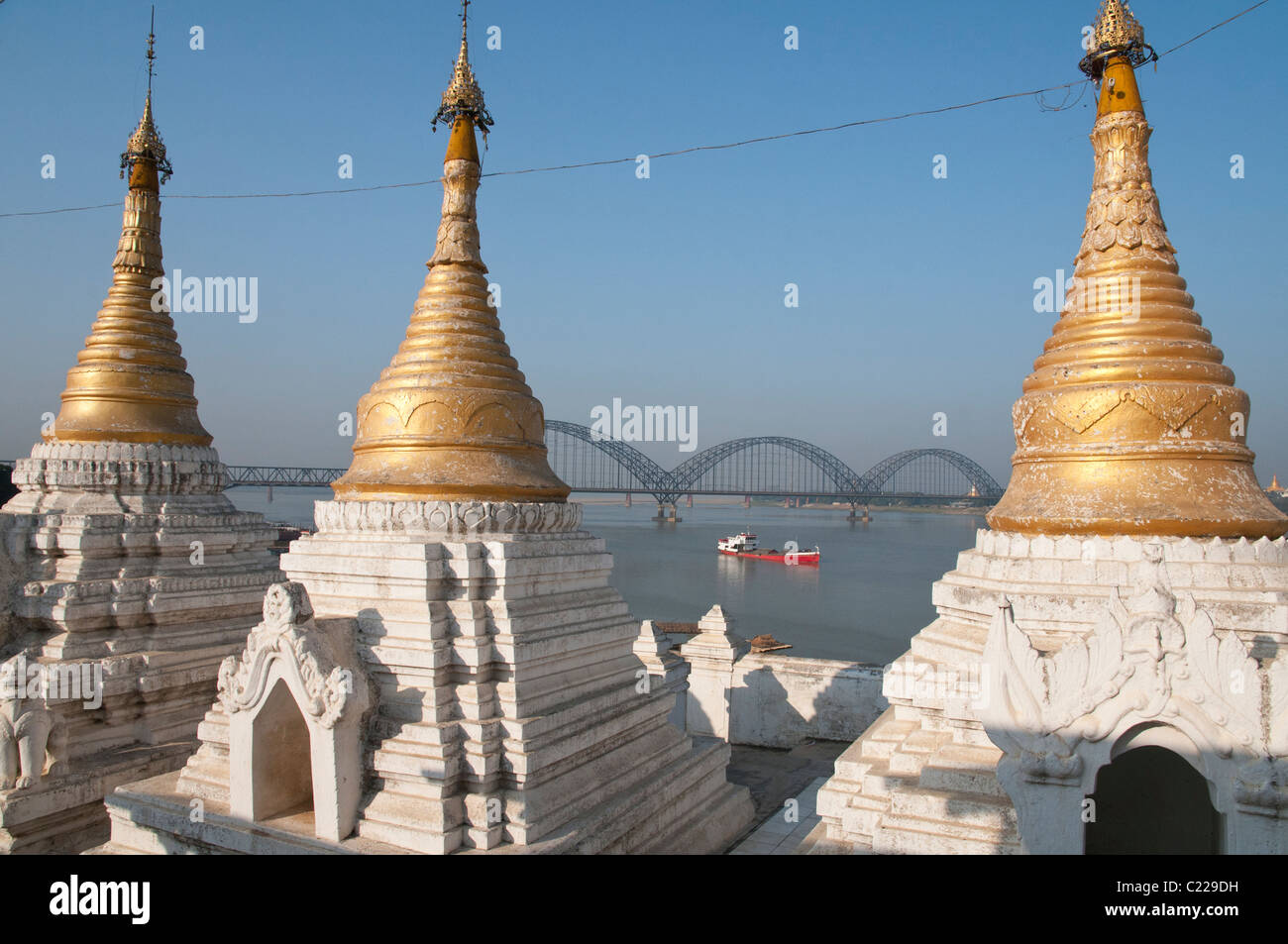 Stupas with irrawaddyi river and yadanabon bridge in the background ...