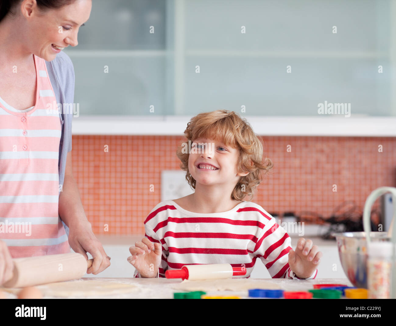 Cute boy baking Stock Photo - Alamy
