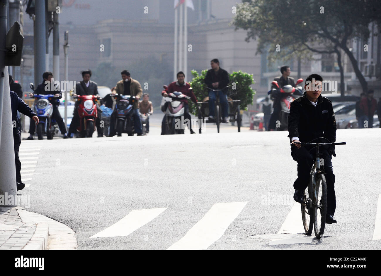 Cyclists in Shanghai, China Stock Photo - Alamy