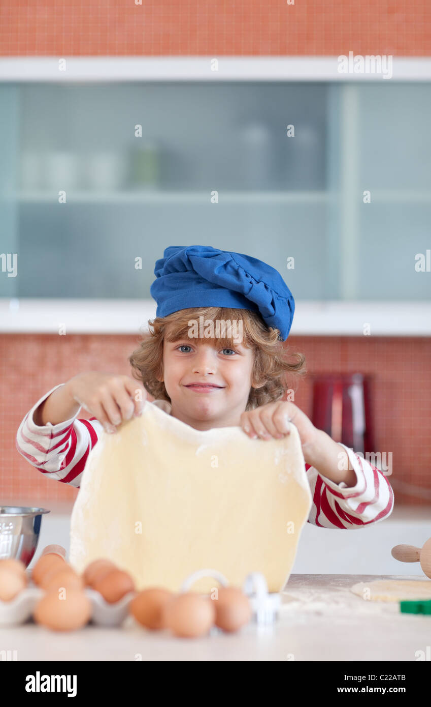 Adorable child baking Stock Photo - Alamy