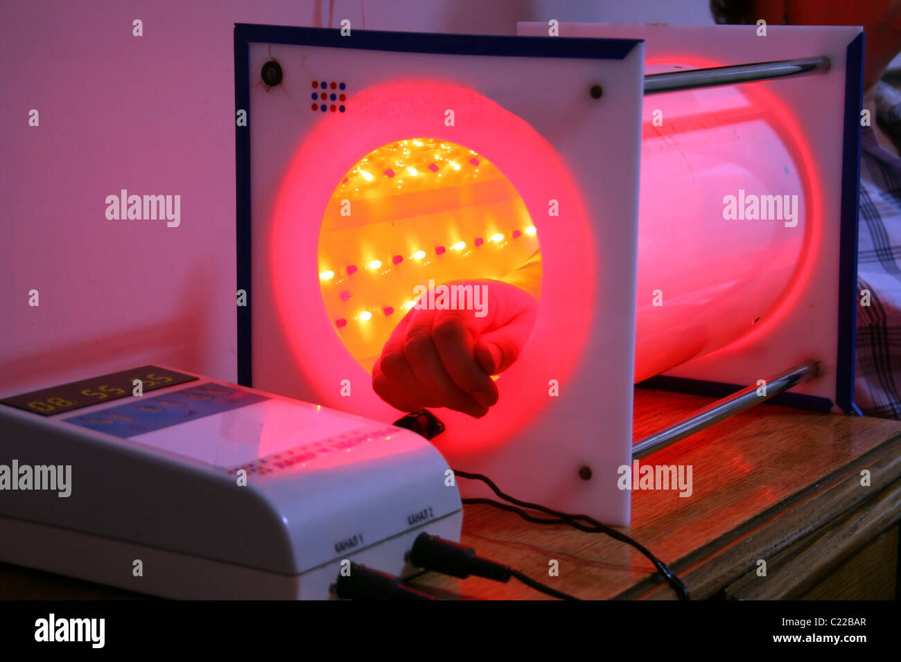 Treatment by the laser, hand of the patient in a laser tunnel Stock ...