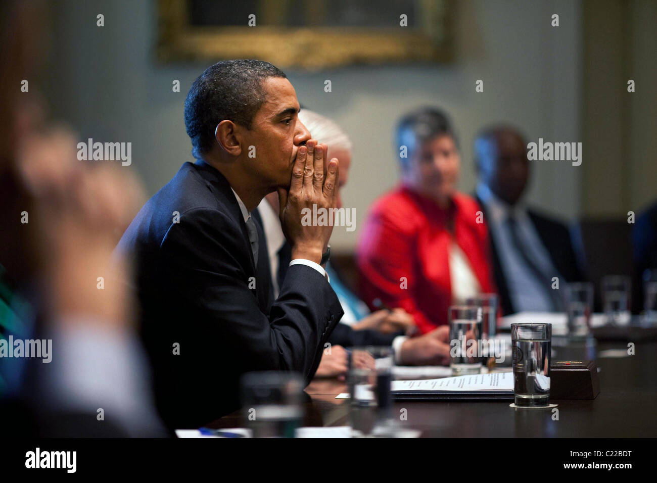 President Barack Obama reflects during a meeting with his full Cabinet ...
