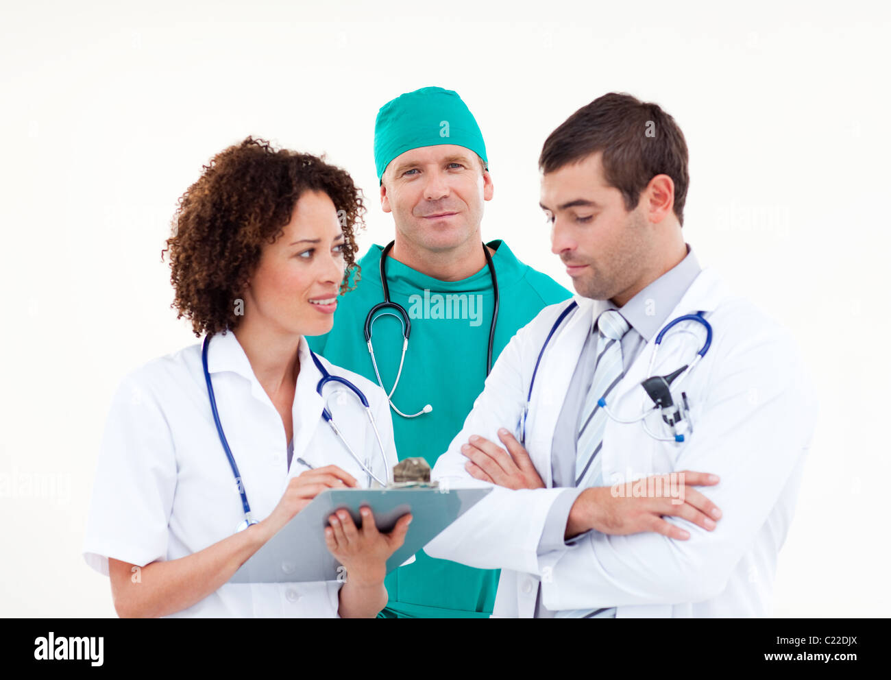 Young medical team in discussion against white background Stock Photo ...