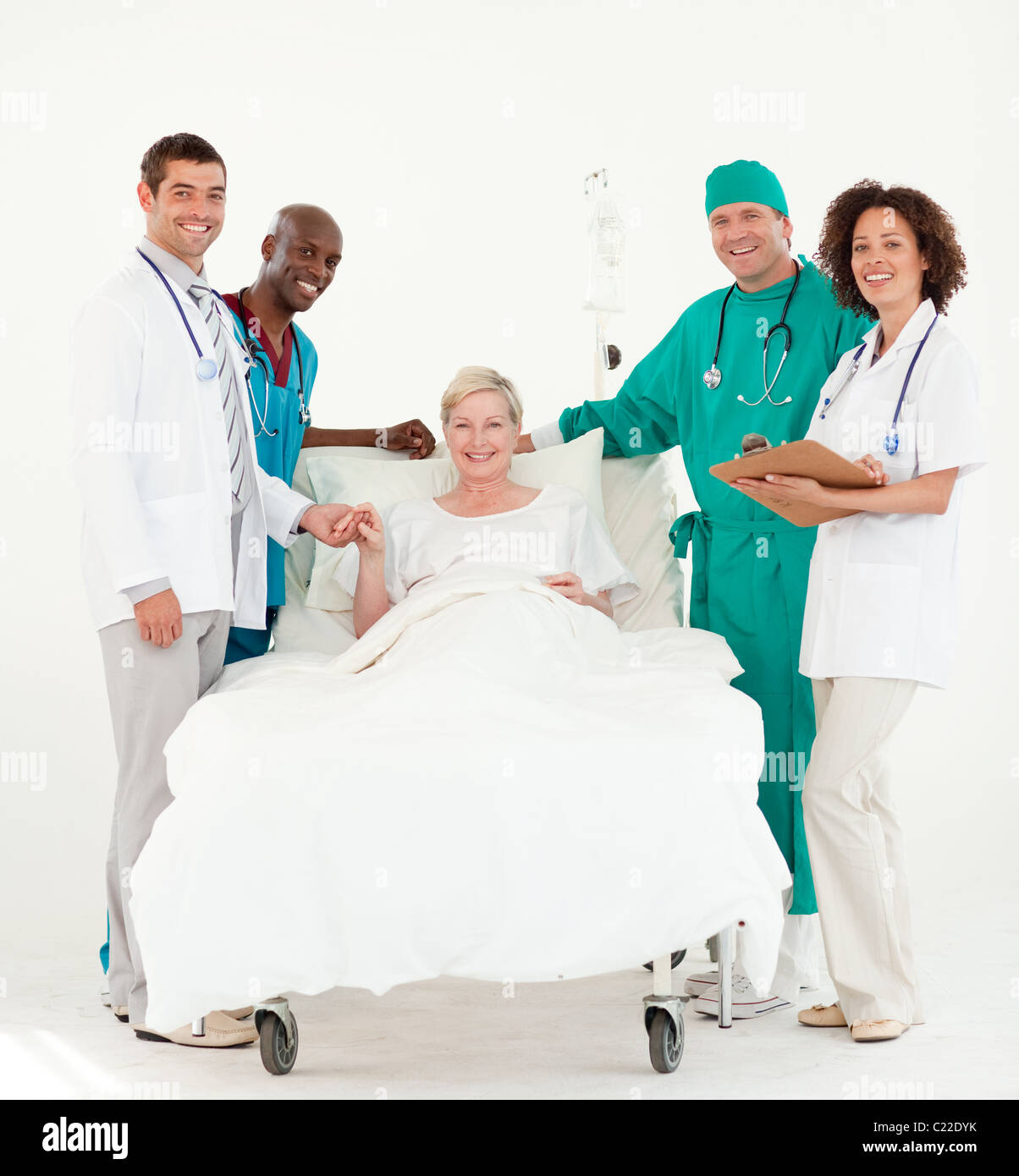 Group of doctors attending to a patient Stock Photo - Alamy