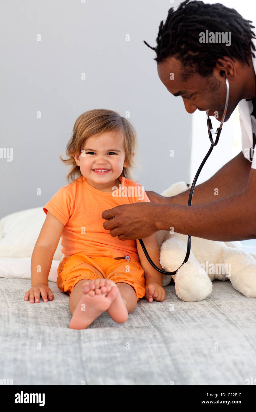 Caring doctor with a child Stock Photo - Alamy