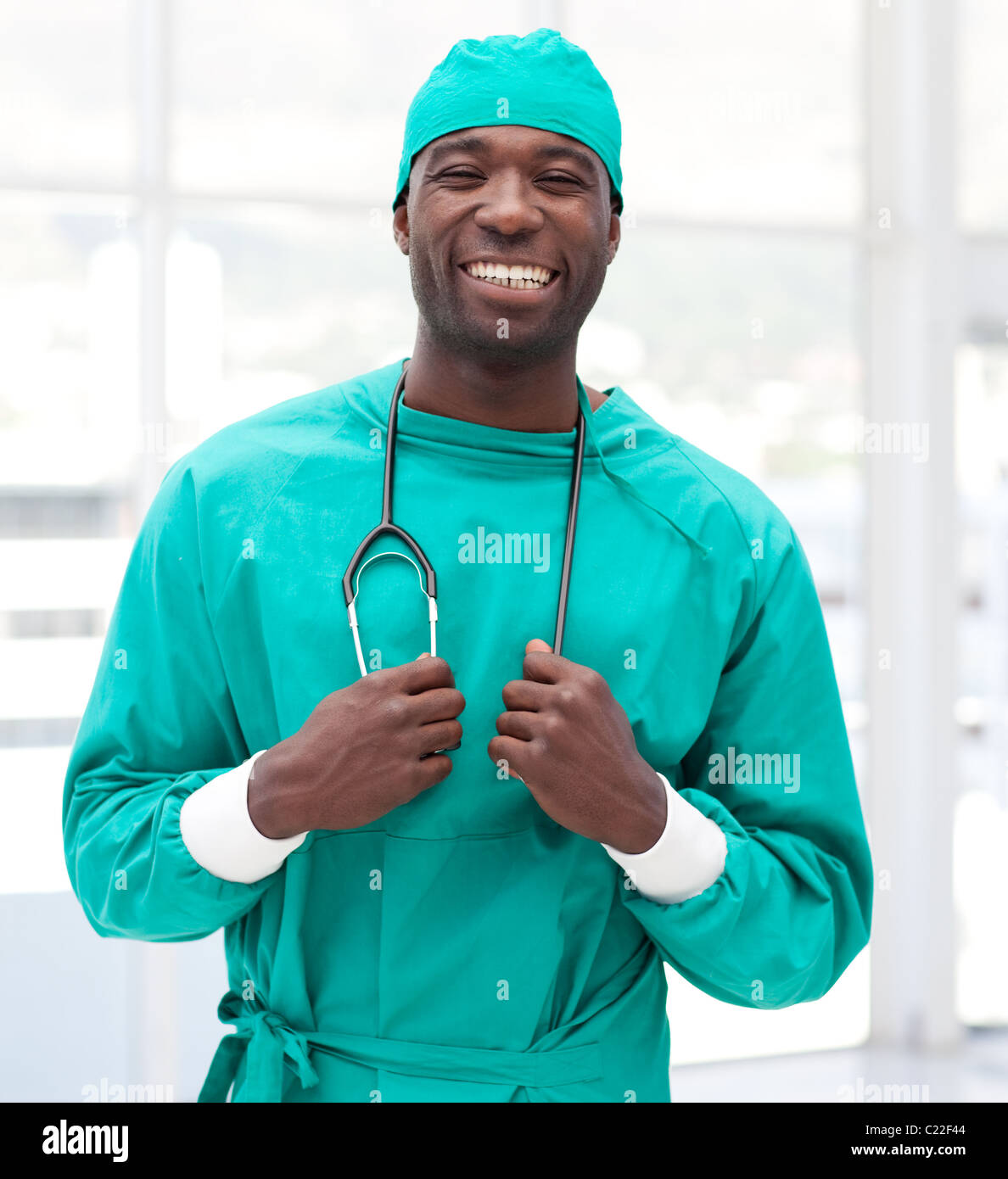 Glowing doctor holding a stethoscope Stock Photo - Alamy