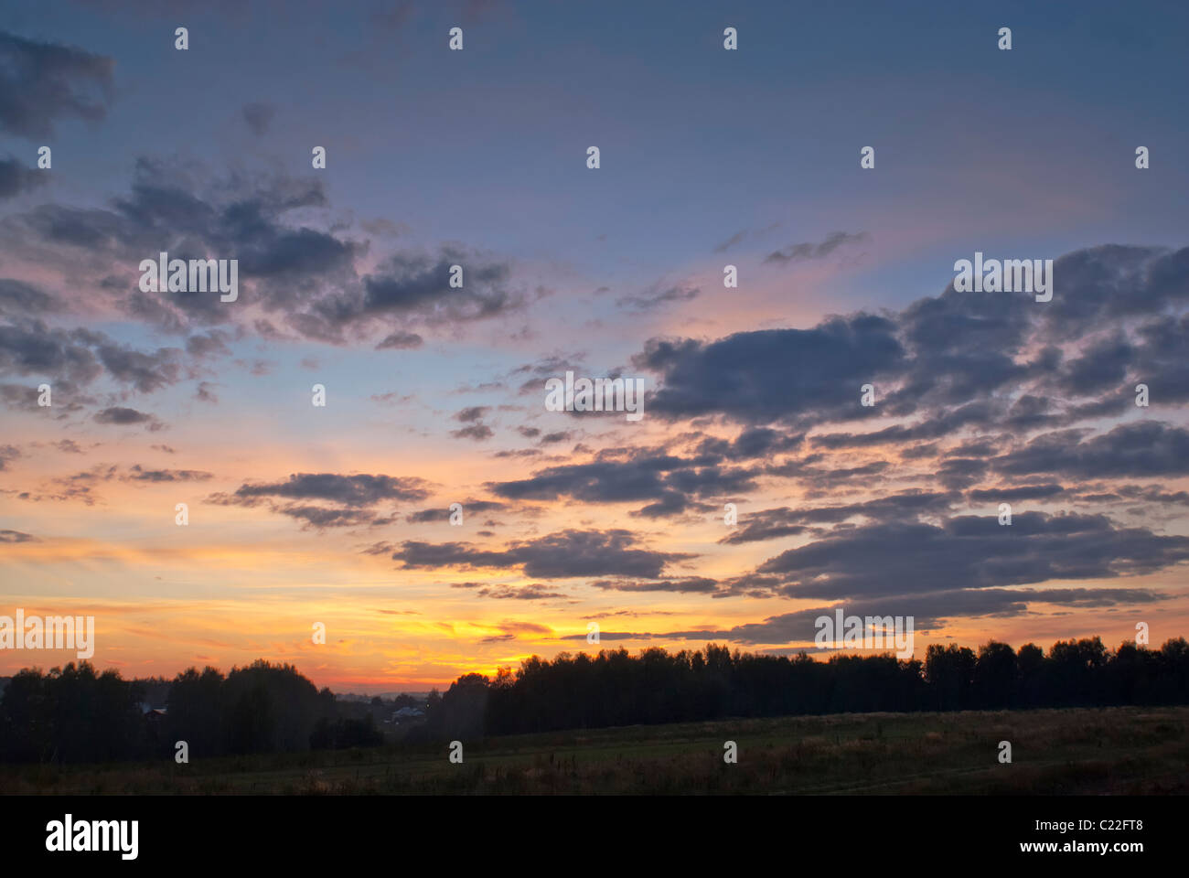 Sunset over rural landscape Stock Photo - Alamy