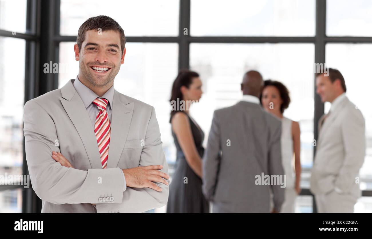 Male manager leading his team Stock Photo - Alamy