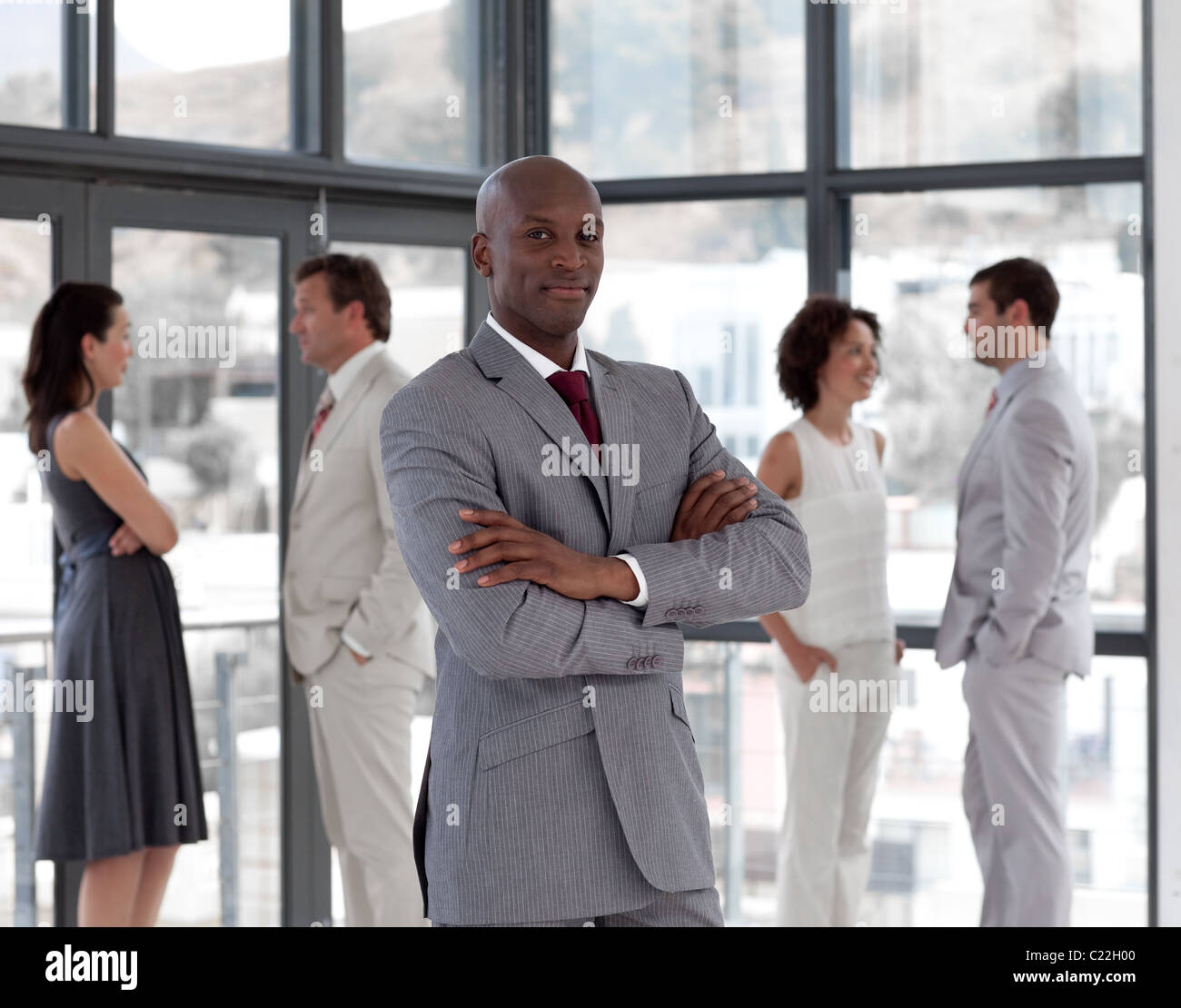 portrait of a confident male manager leading his team Stock Photo - Alamy