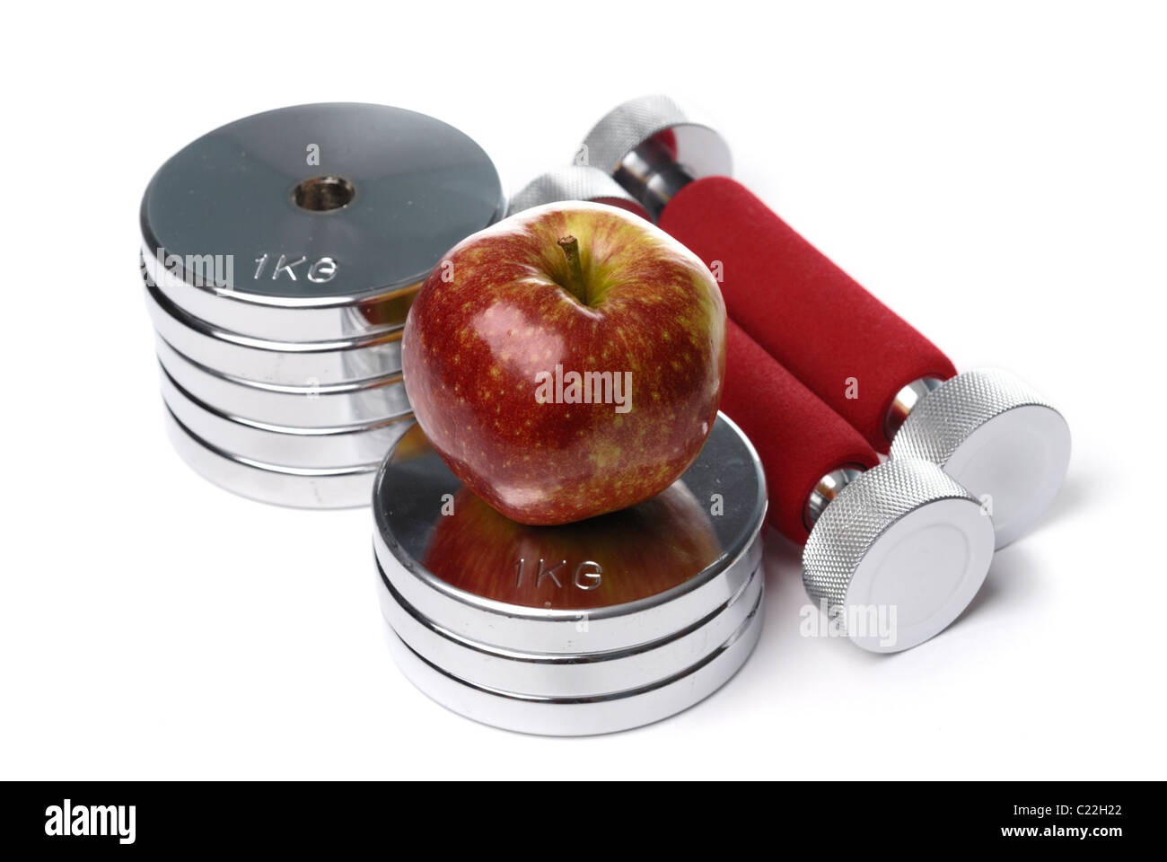 Barbells and apple isolated on white background Stock Photo - Alamy