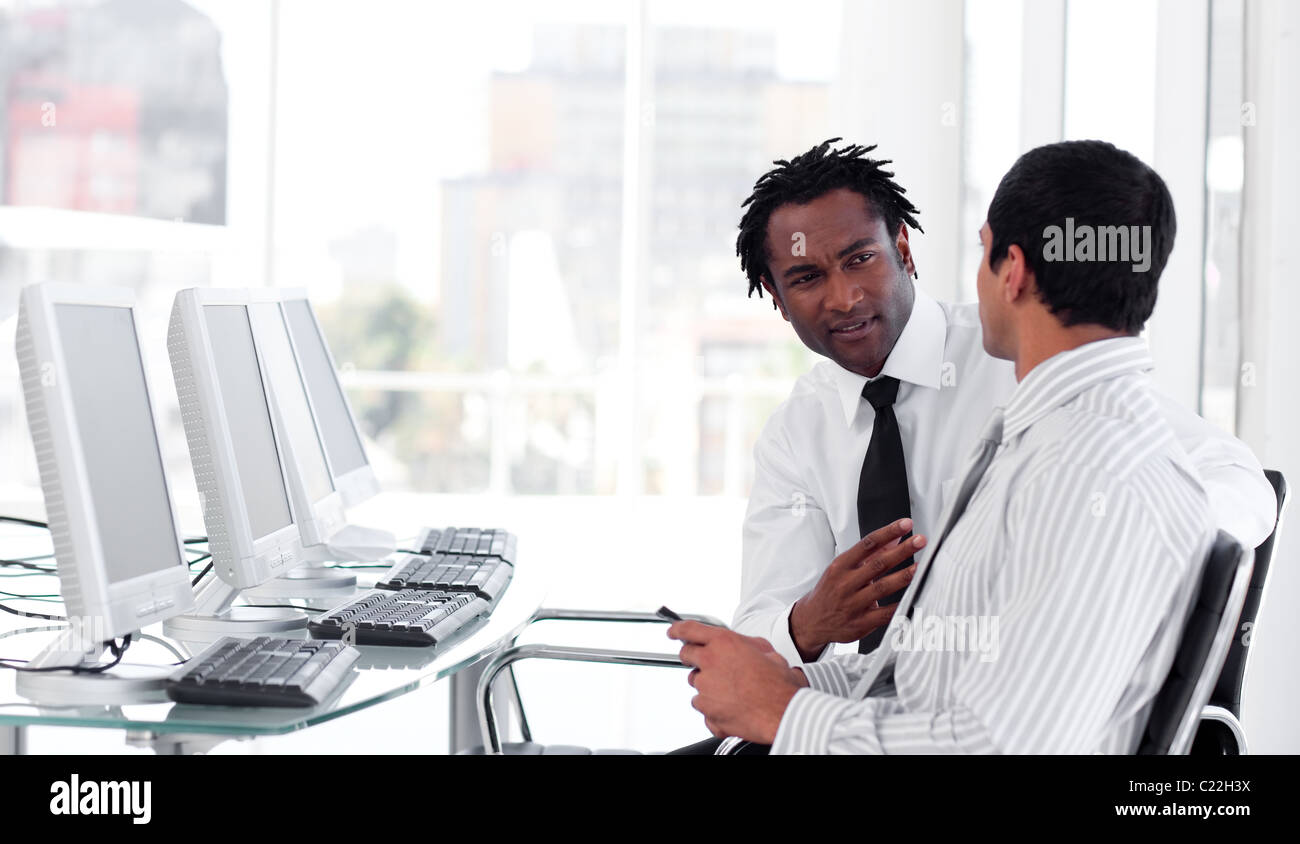 Male Business colleagues talking together Stock Photo - Alamy