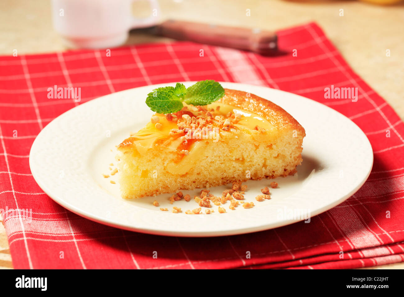 Sponge cake topped with sweet cheese and syrup Stock Photo - Alamy