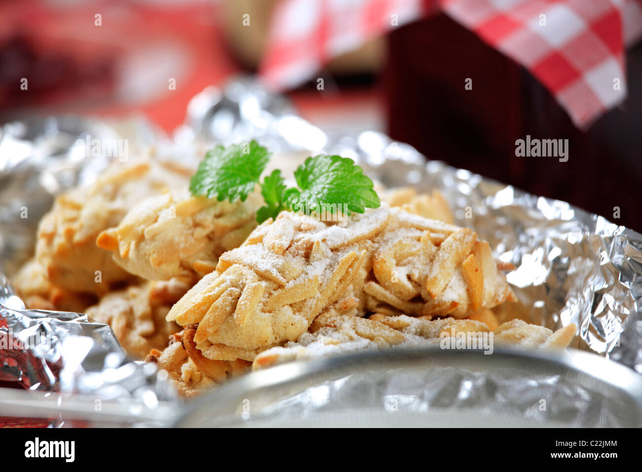Almond treats in aluminum foil - closeup Stock Photo - Alamy