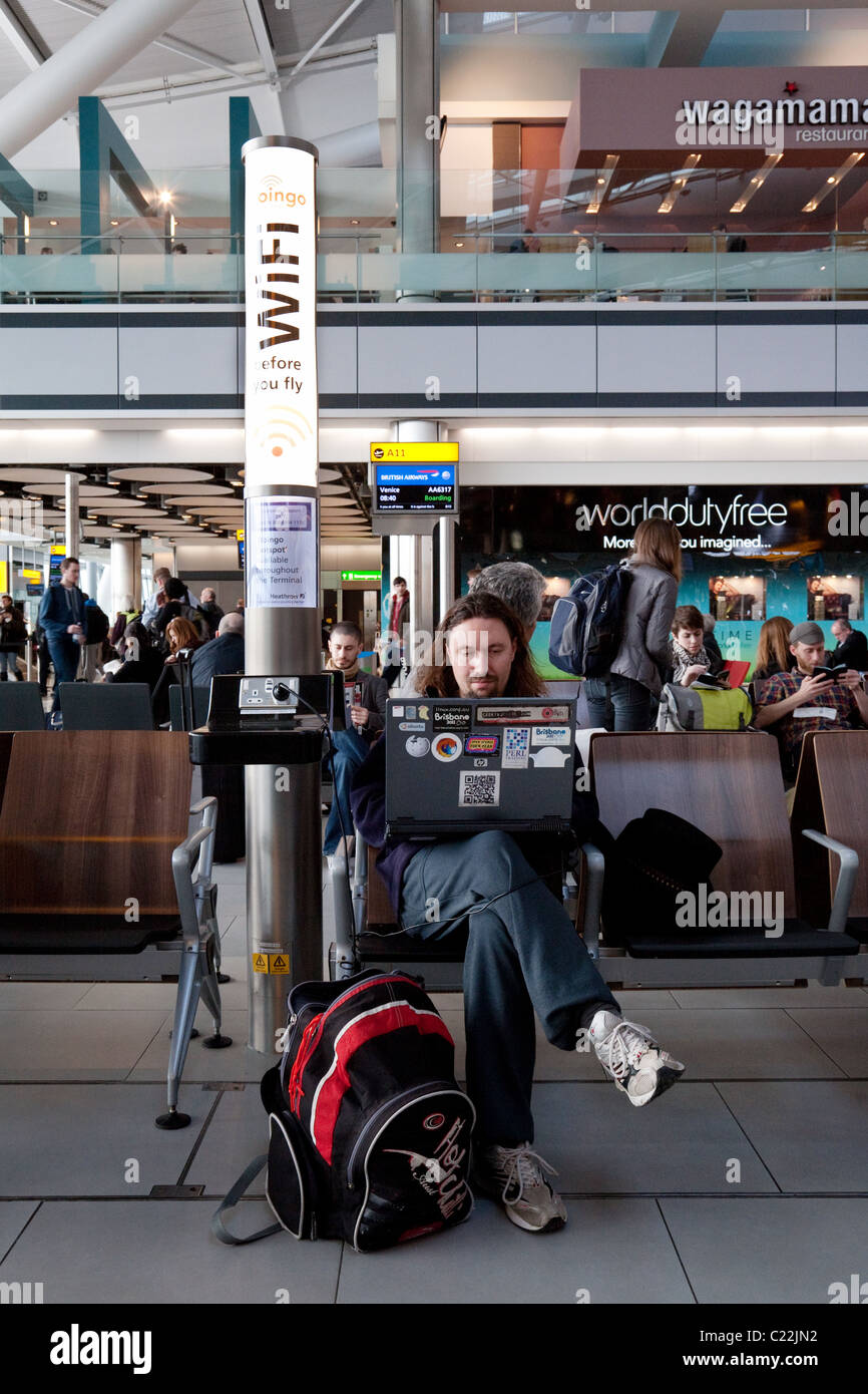 People using the Wi-Fi service at Departures, Terminal 5, Heathrow ...