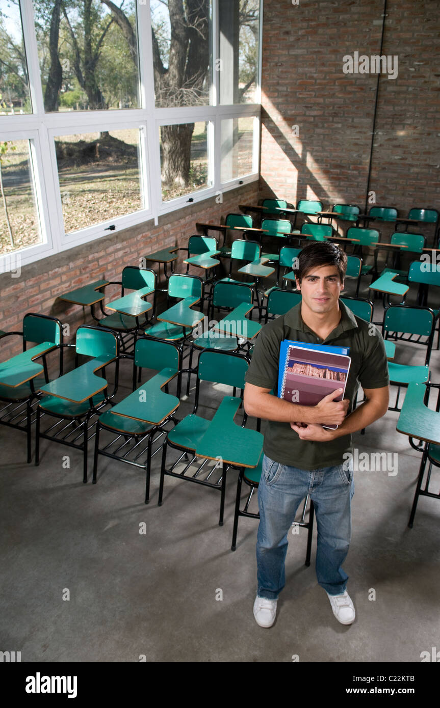 student, at, classroom, holding, books, stand, up, looking, at, the ...