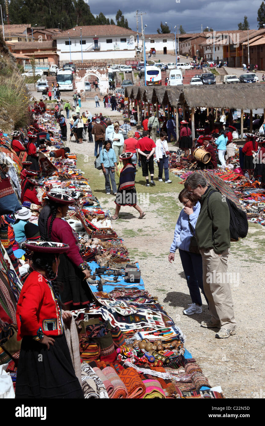 Tourists shopping at Chinchero market , Sacred Valley , near Cusco ...