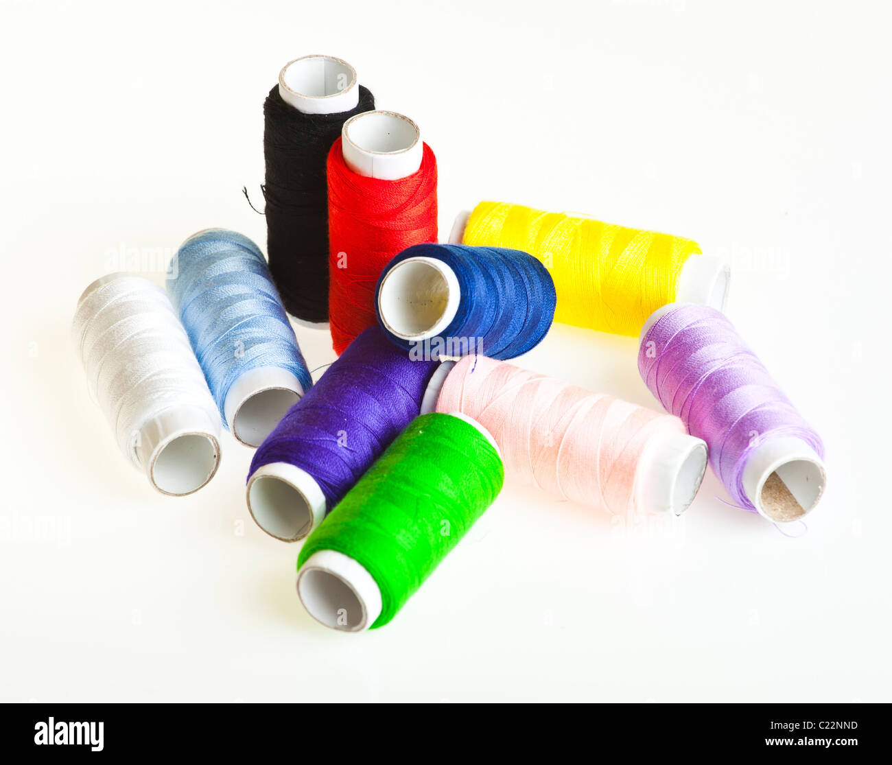 Colorful sewing threads and tools on white isolated background Stock ...