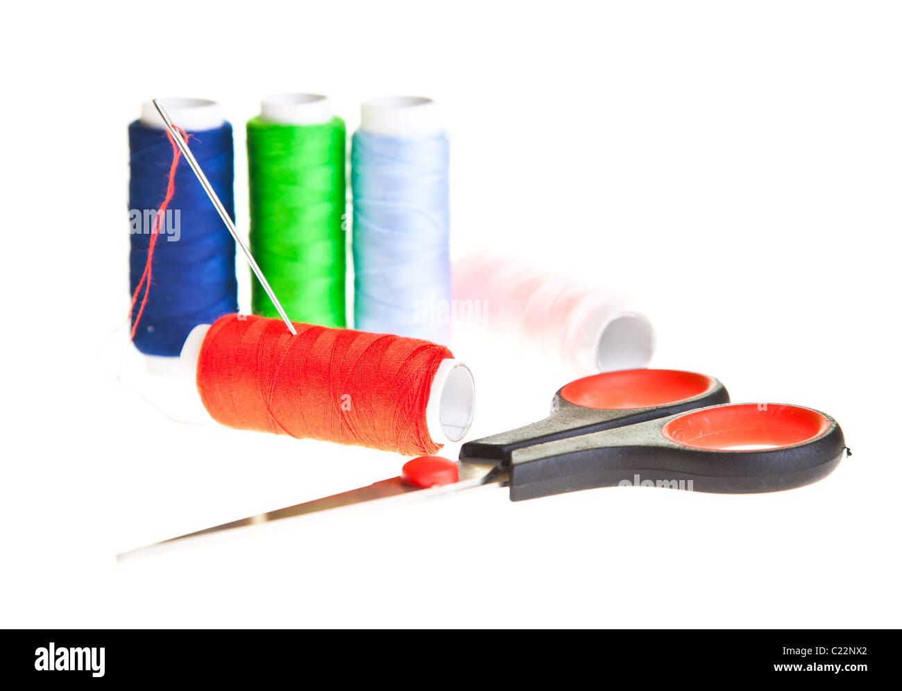 Colorful sewing threads and tools on white isolated background Stock ...