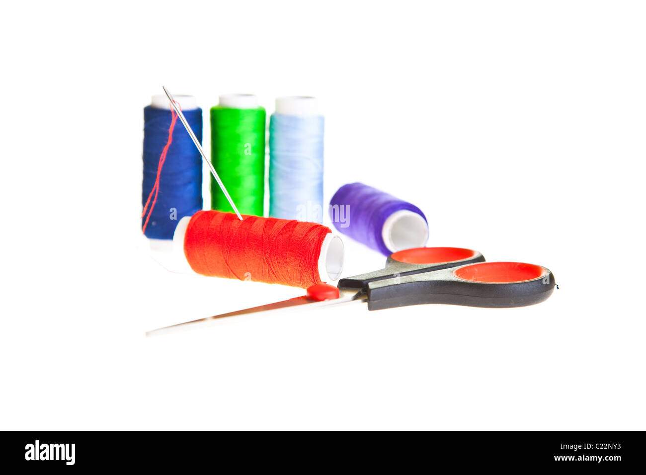 Colorful sewing threads and tools on white isolated background Stock ...