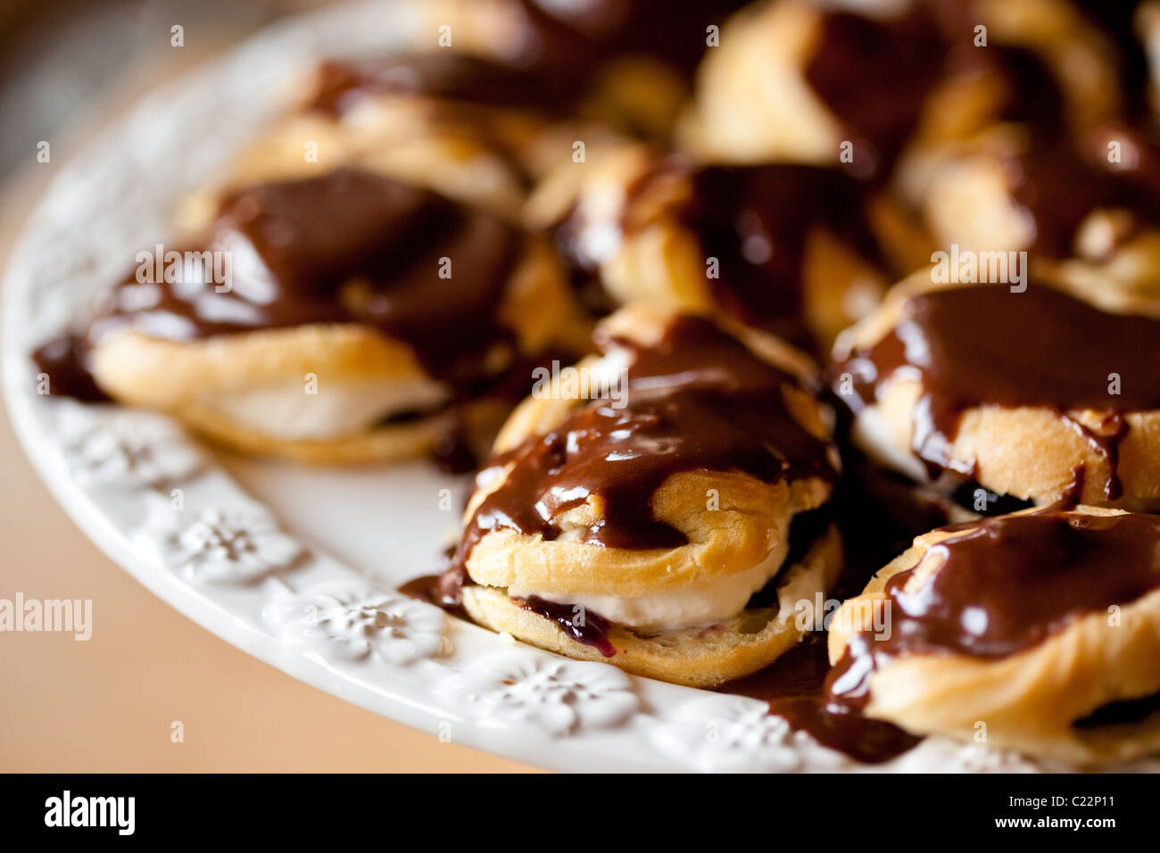 Cream puffs, with blueberry jam, whipped cream and chocolate glaze ...