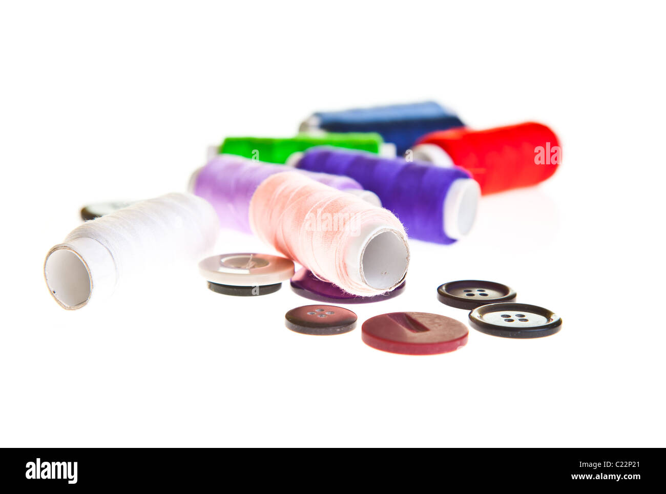 Colorful sewing threads and tools on white isolated background Stock ...