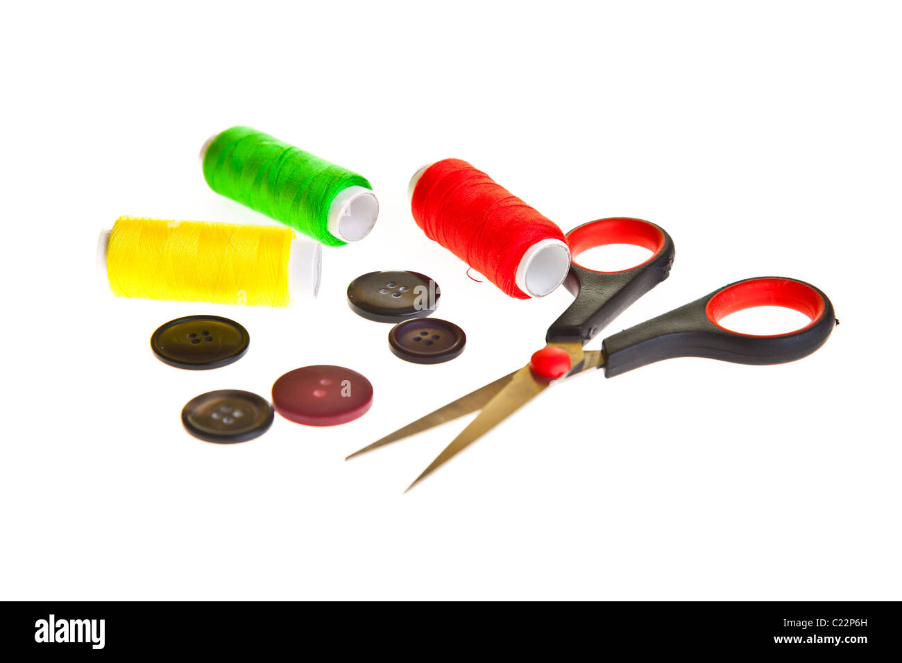 Colorful sewing threads and tools on white isolated background Stock ...