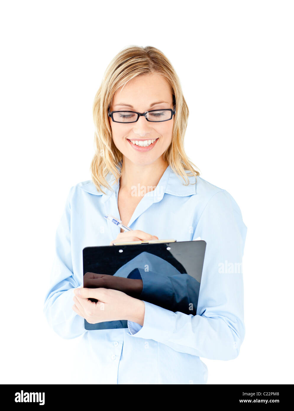 Confident businesswoman taking notes on a clipboard Stock Photo - Alamy