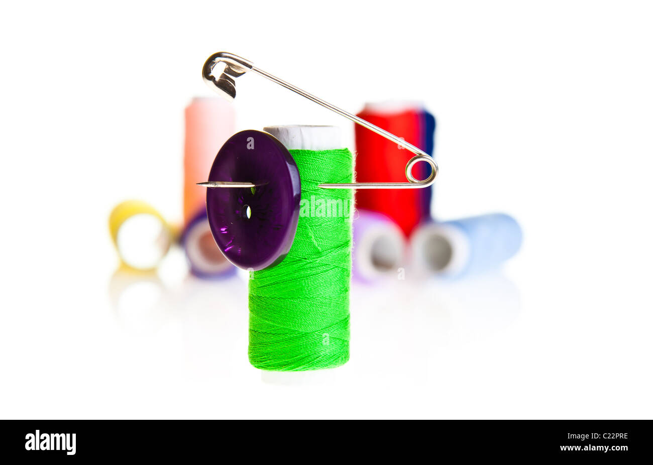 Colorful sewing threads and tools on white isolated background Stock ...
