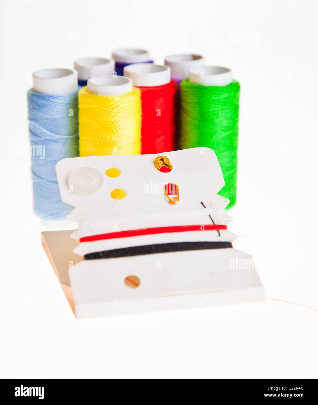 Colorful sewing threads and tools on white isolated background Stock ...