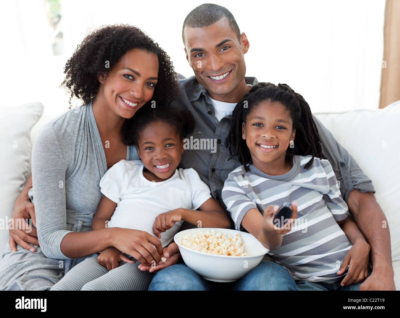 Family watching television at home Stock Photo - Alamy