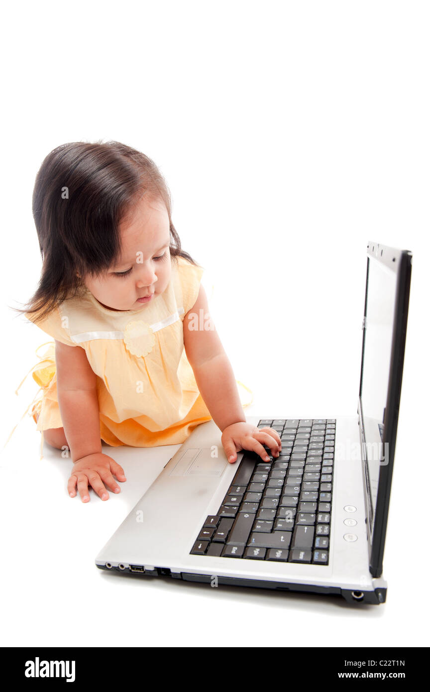 Asian child using an computer laptop Stock Photo - Alamy