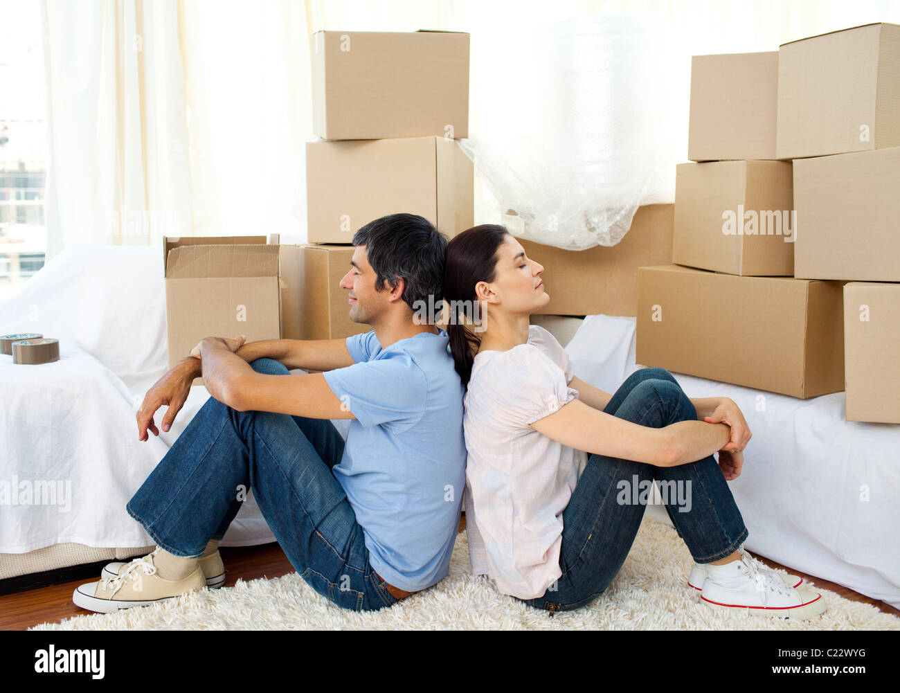 Tired family relaxing moving house hi-res stock photography and images ...