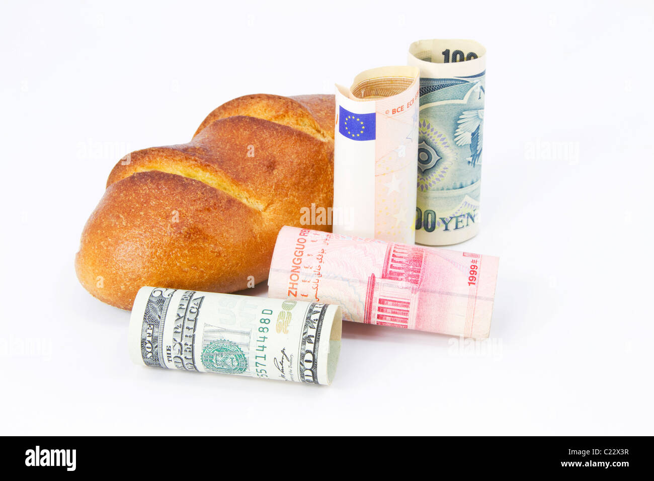 Basic loaf of bread is placed with multiple currencies, dollar, yuan ...