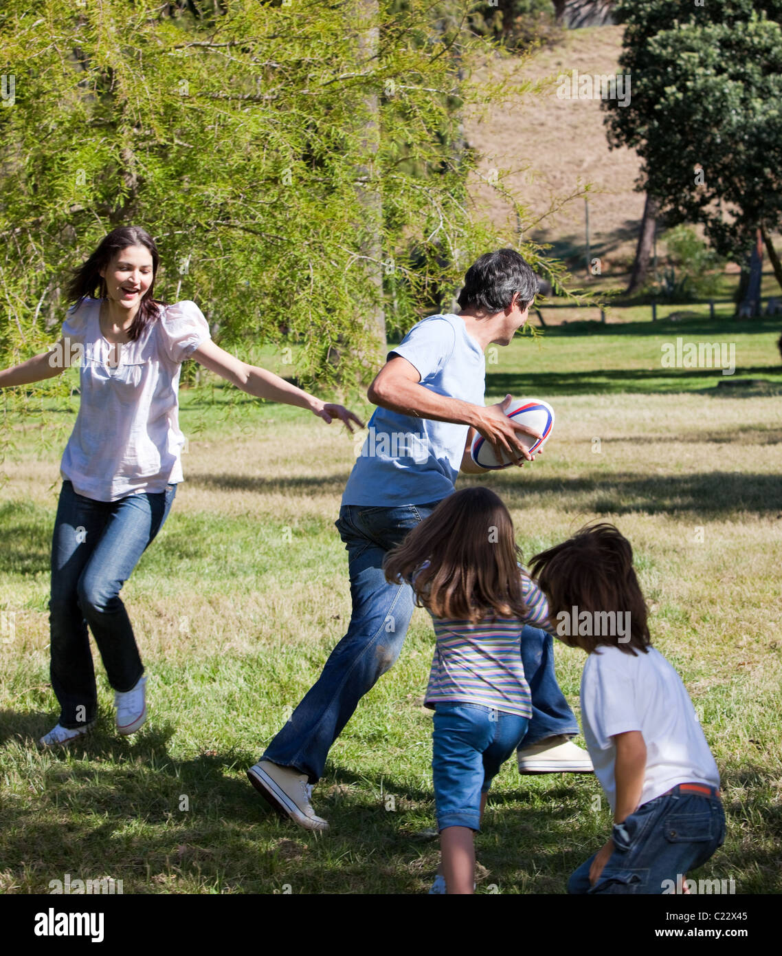 Animated family playing rugby Stock Photo - Alamy