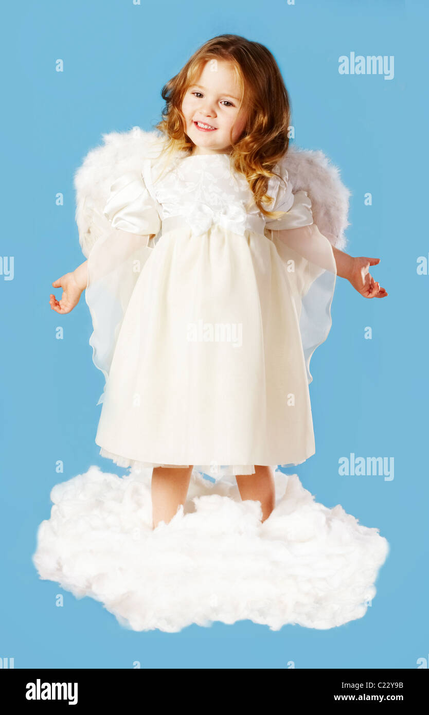 Portrait of cute little cupid standing on cloud Stock Photo - Alamy