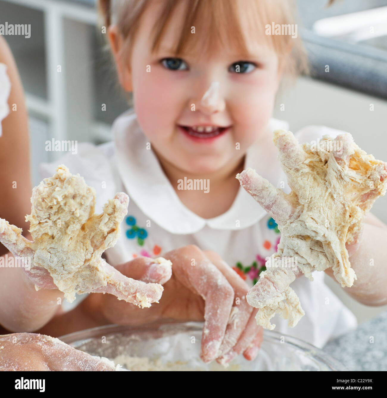 Sweet child baking cookies with hands Stock Photo - Alamy
