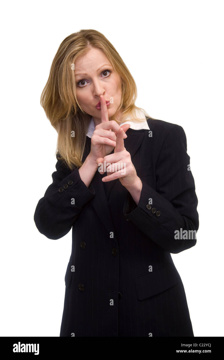 Woman pointing and hushing Stock Photo - Alamy