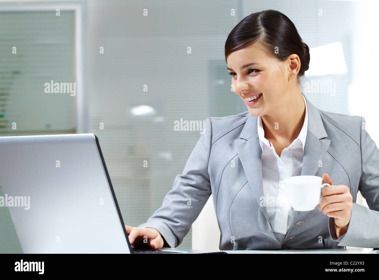 Image of young employer doing computer work in office Stock Photo - Alamy