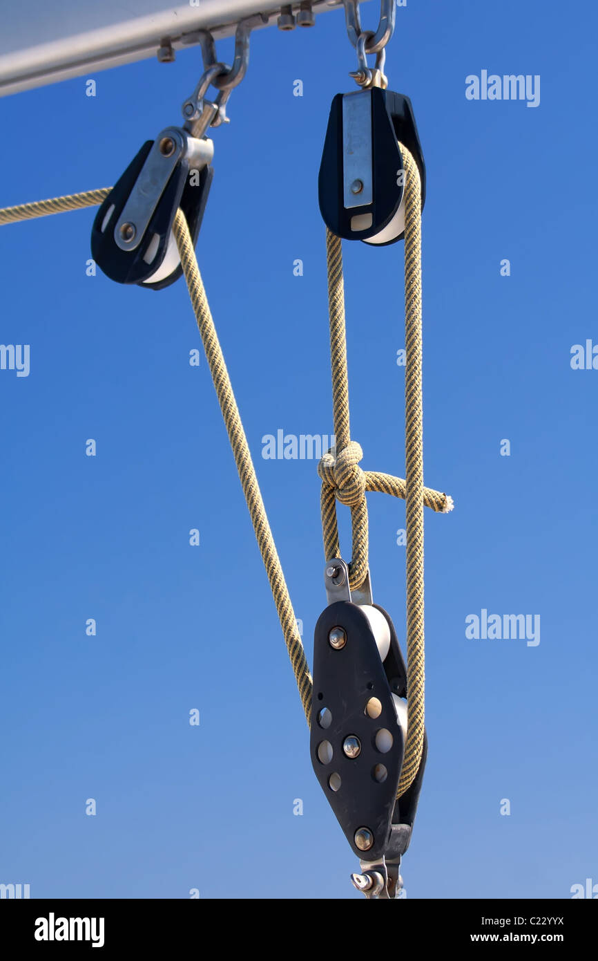 Rope on blocks on blue background Stock Photo - Alamy