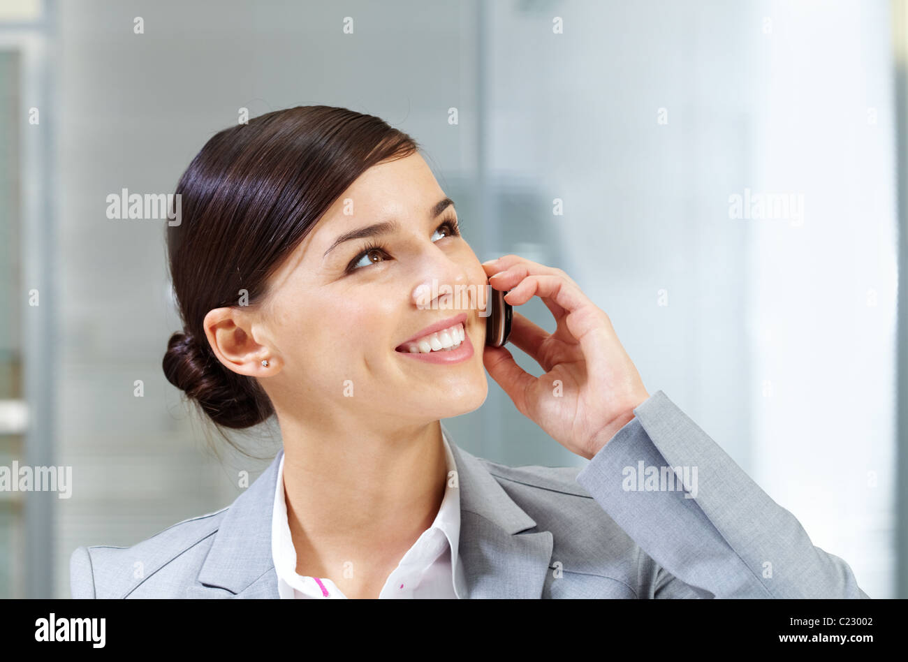 Image of busy businesswoman calling by mobile during her work Stock ...