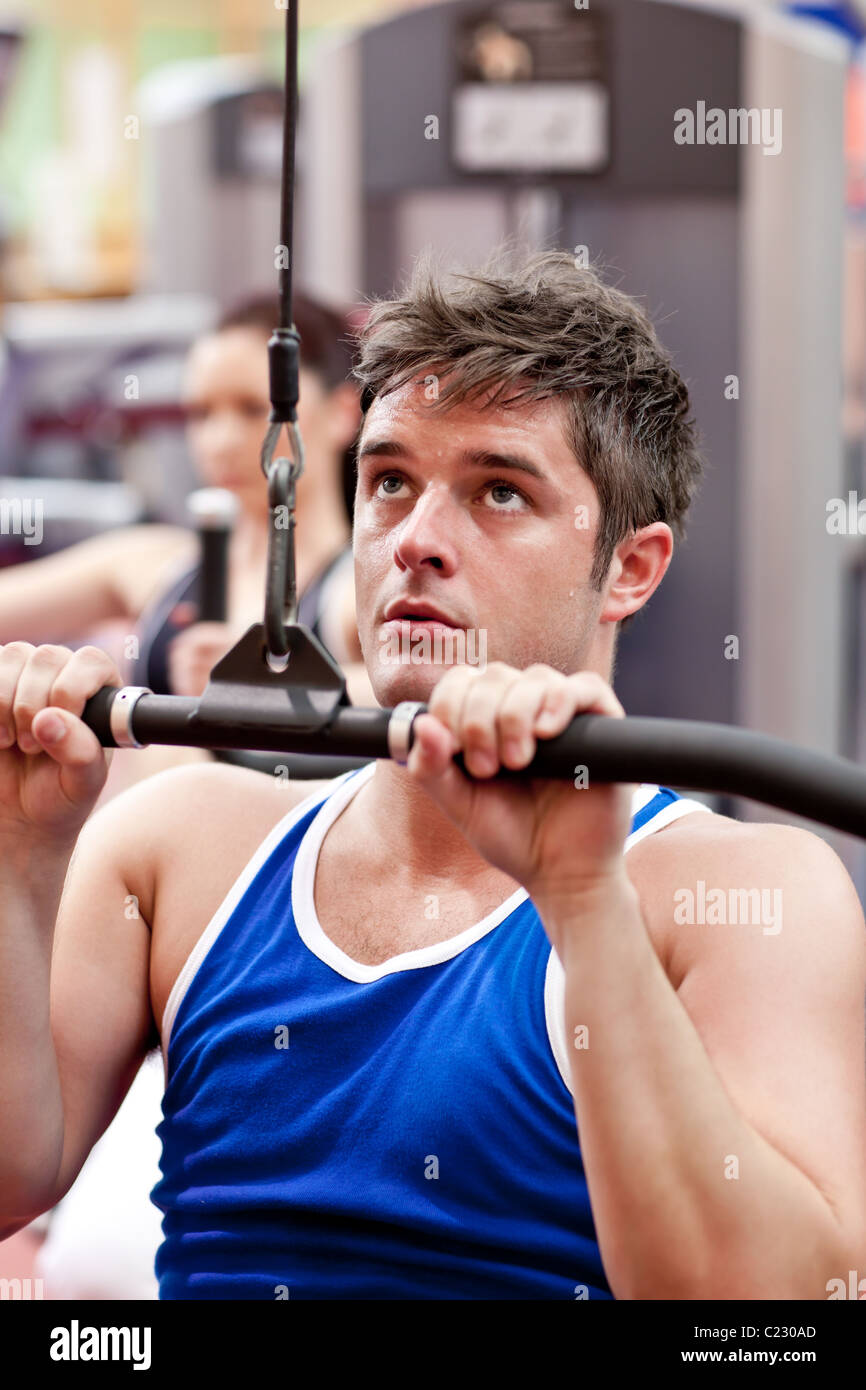 Muscular male athlete practicing body-building Stock Photo - Alamy