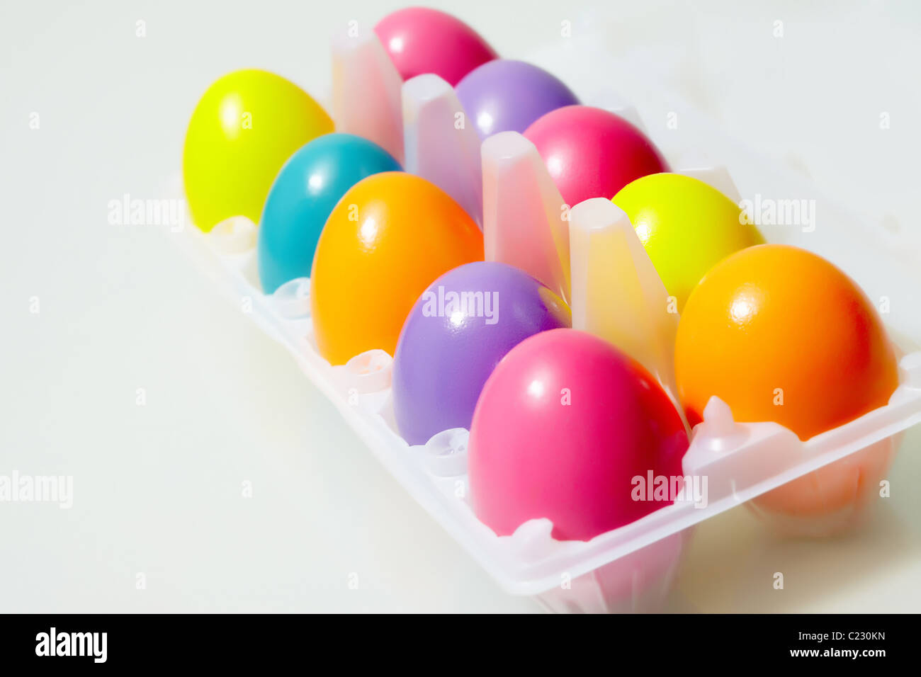 Colorful Easter eggs placed in container Stock Photo - Alamy