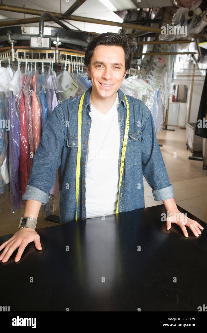 Man working in laundrette hi-res stock photography and images - Alamy