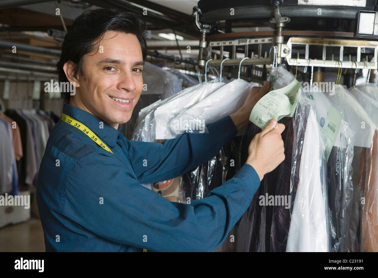 Man working in laundrette hi-res stock photography and images - Alamy