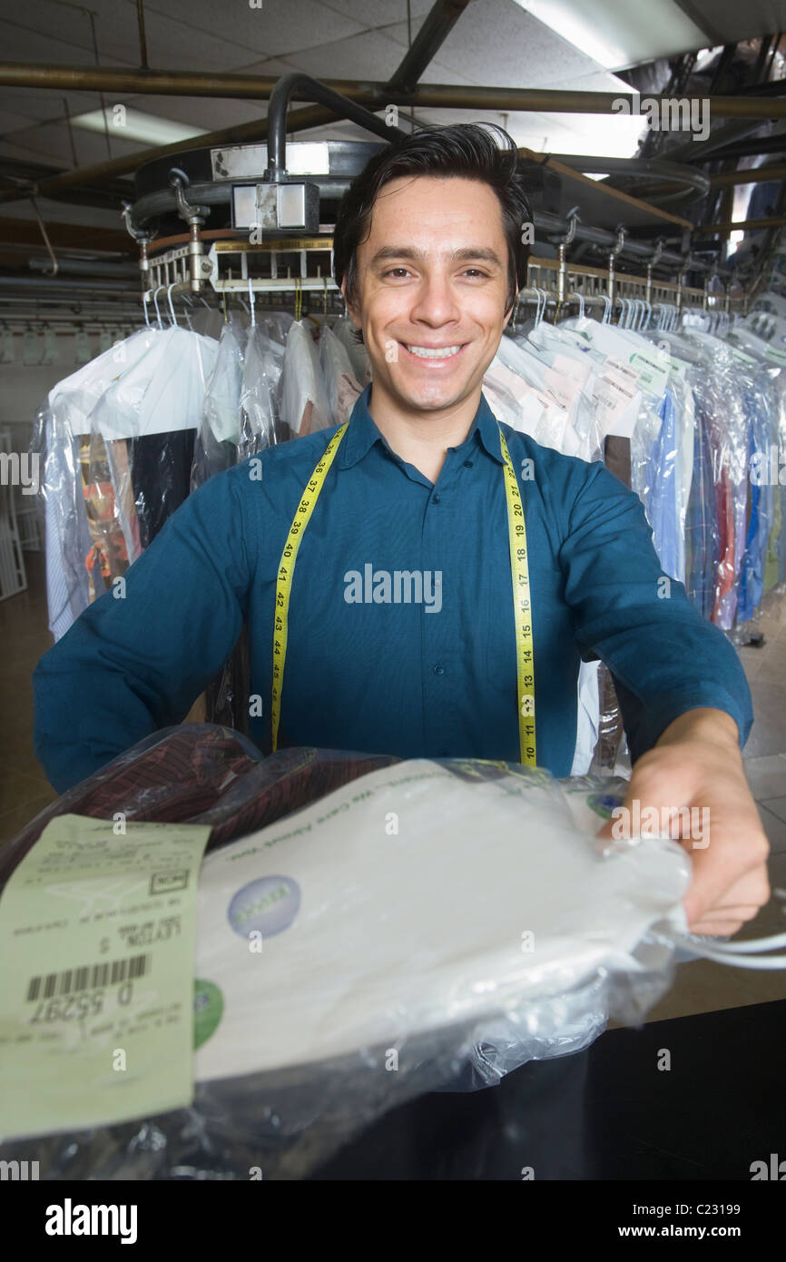 Man working in laundrette hi-res stock photography and images - Alamy